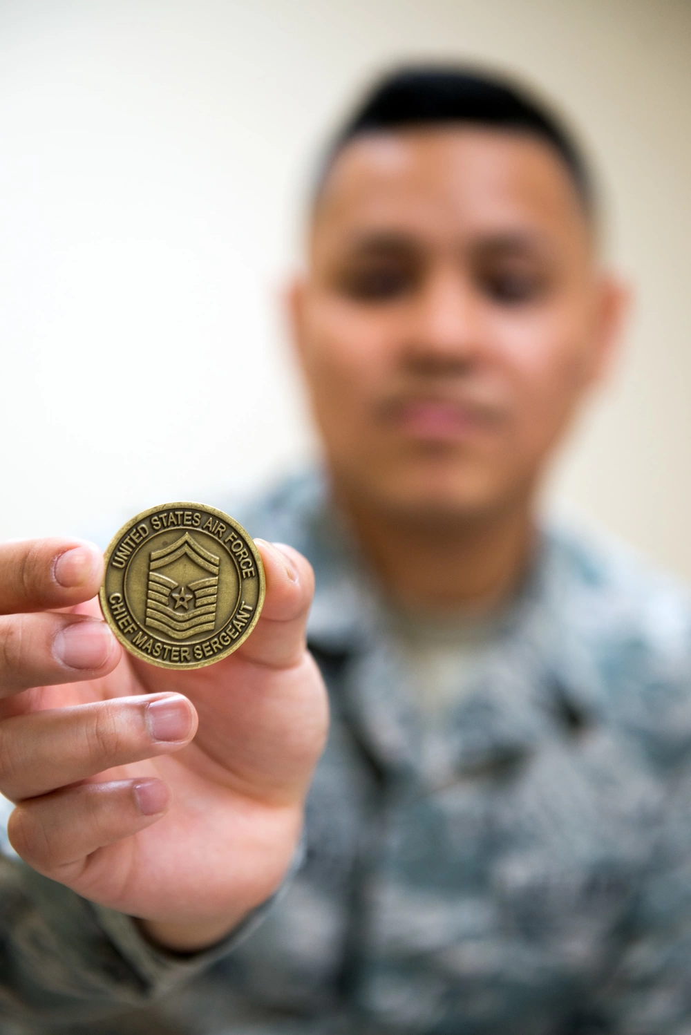 DVIDS - Images - AMC/CCC gives meaningful coin to Airman [Image 3 of 3]