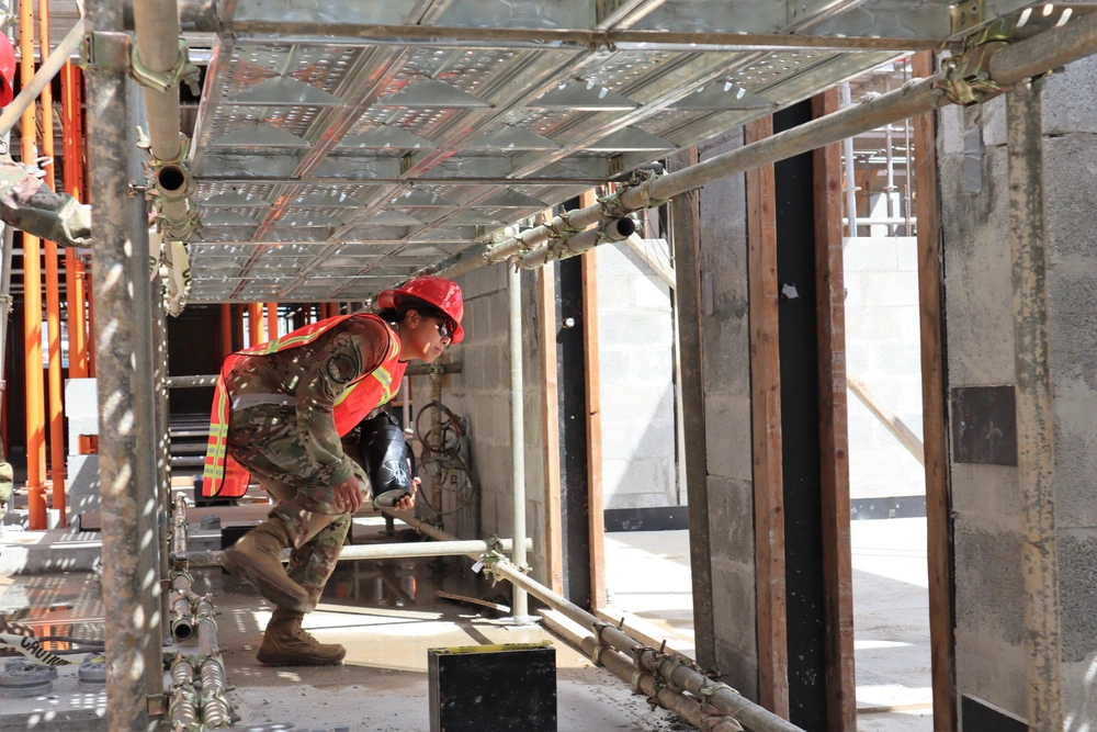 DVIDS - Images - A Civil Engineering Officer Ducks Under Scaffolding ...