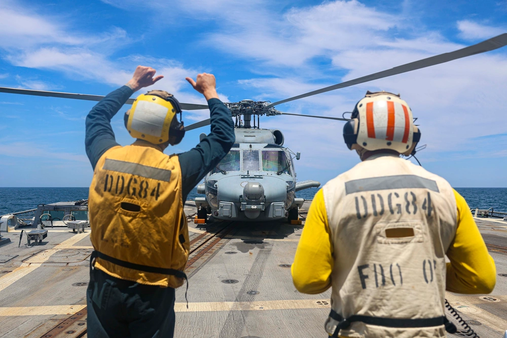 DVIDS - Images - BM1 Jason Carpenter and BM1 Youssef Belakbir signal ...