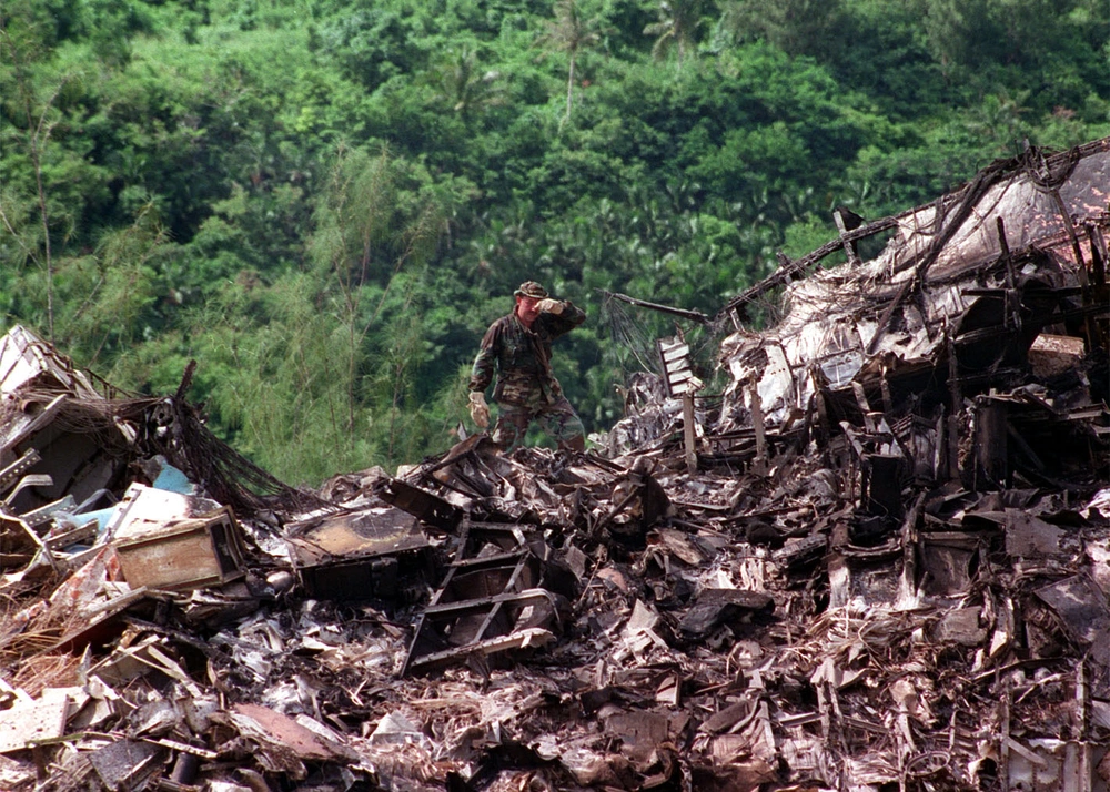 DVIDS - Images - A rescuer works atop the wreckage of KAL Flight 801