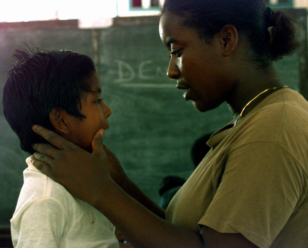 DVIDS - Images - Sgt. Angela Williams examines a young patient's teeth ...