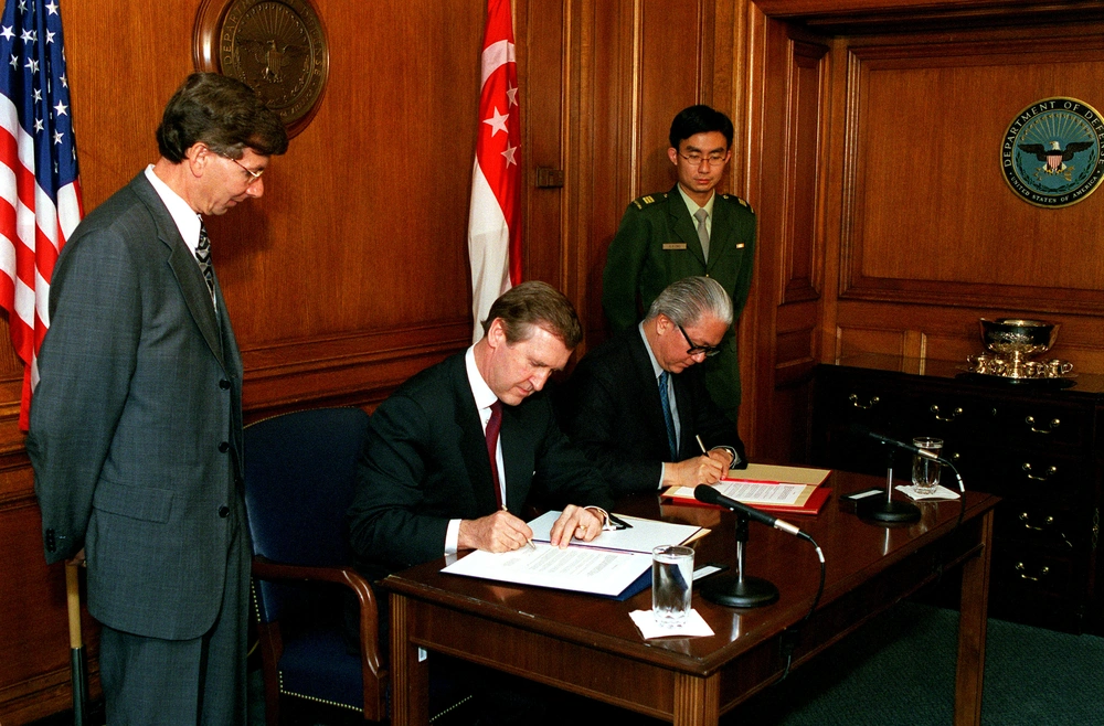 DVIDS - Images - Secretary Cohen and Deputy Prime Minister Tan sign a ...