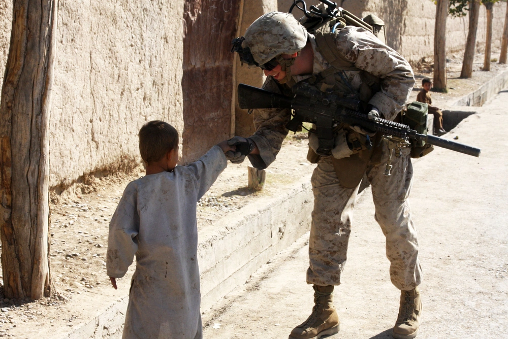 DVIDS - Images - Lance Cpl. Steven J. Zandstra shakes hands with an ...