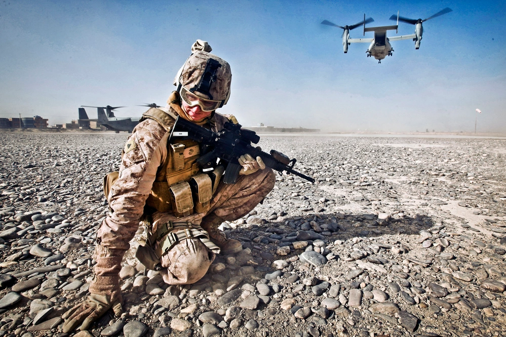 DVIDS - Images - Cpl. William Cox shields himself from flying rocks and ...