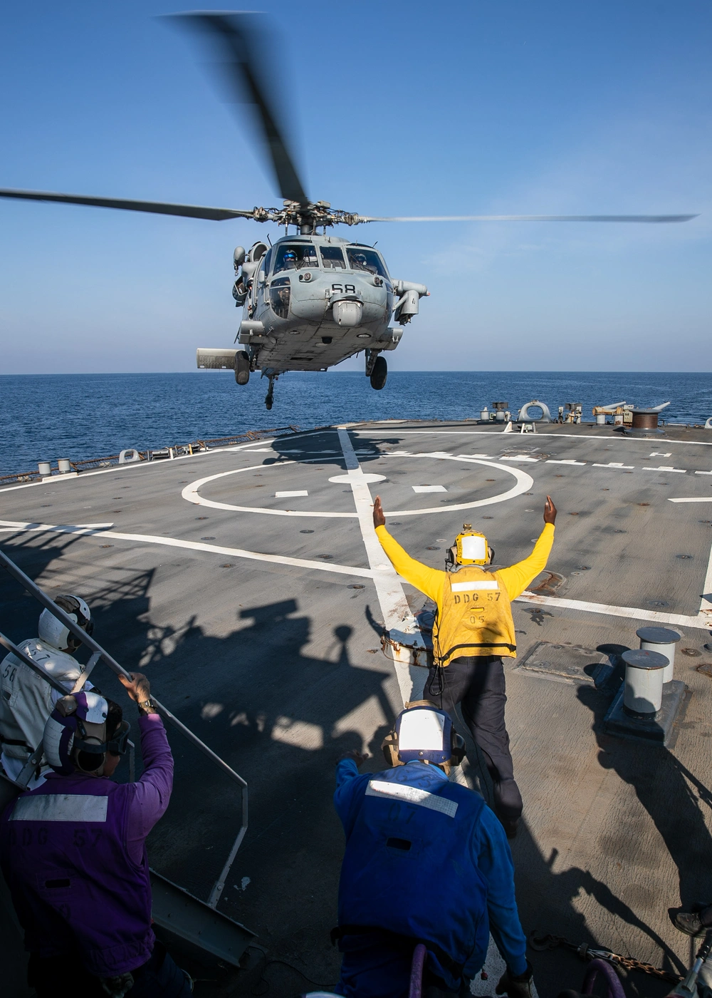 DVIDS - Images - USS Mitscher (DDG 57) Sailor signals to HSM 26 Sea ...