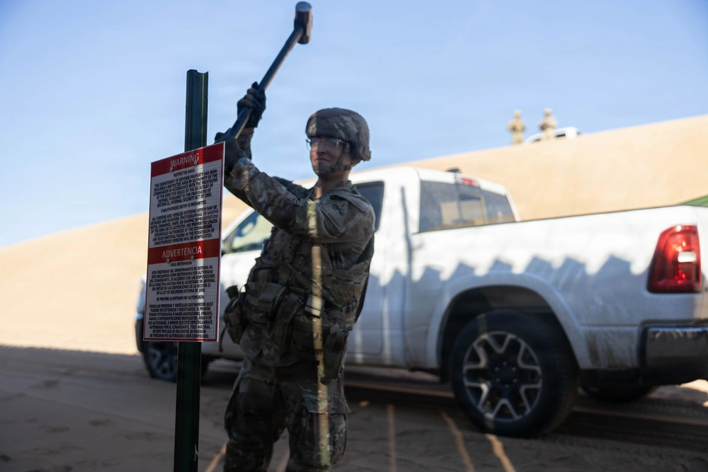 DVIDS - Images - Soldiers place NDA 5 signs [Image 3 of 3]
