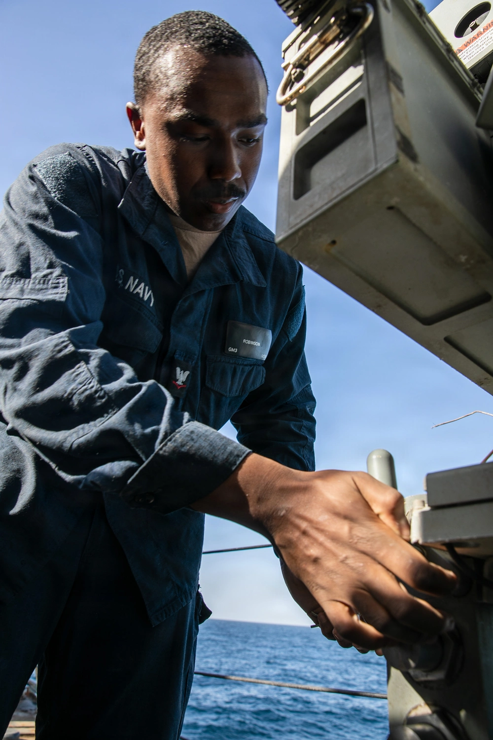 DVIDS - Images - USS Mitscher (DDG 57) Sailor conducts maintenance on ...