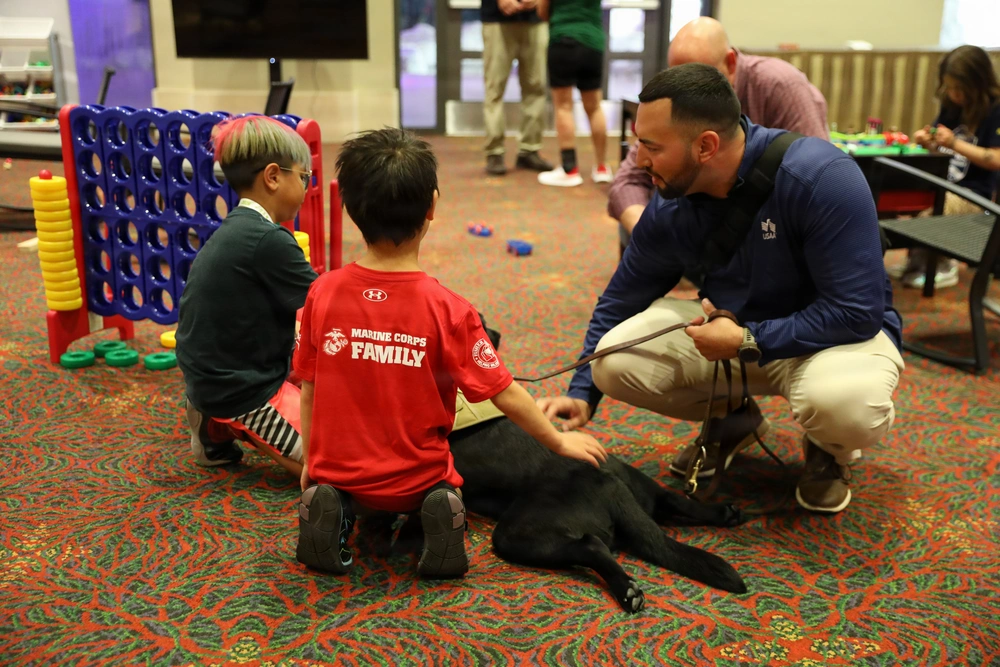 DVIDS - Images - Smoky the therapy dog meets families at 2026 Warrior ...